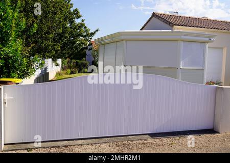 modern white gate pvc plastic portal with blades of suburbs house Stock ...