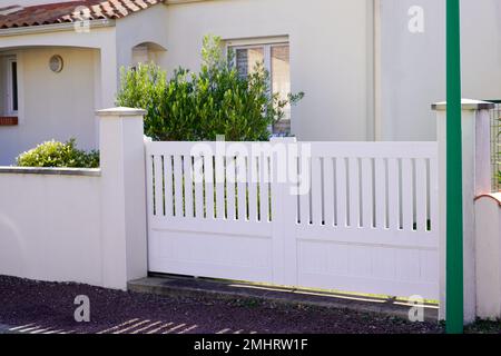 suburb portal home white pvc plastic house gate slats door Stock Photo ...