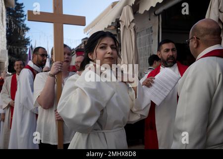 Sally Ibrahim Azar, center, a Palestinian Christian and Council member ...