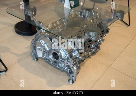 Engine block of a V8 being used as a coffee table with a glass top ...