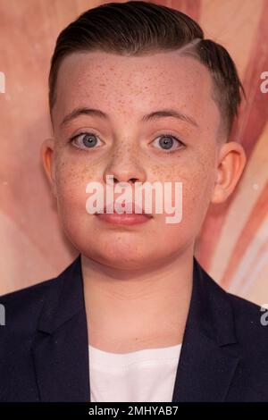 Actor Lewin Lloyd poses for photographers upon arrival at the premiere ...