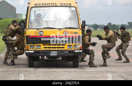 Indian Air Force's Garud commandos display their skills during an event ...