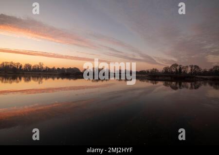 Sunrise reflections on the River Trent at Colwick Park in Nottingham ...