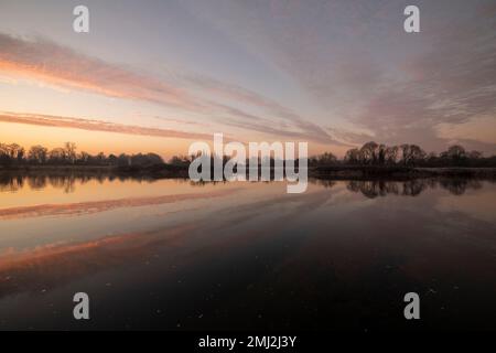 Sunrise reflections on the River Trent at Colwick Park in Nottingham ...