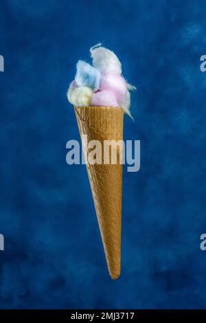 Colored cotton balls in various containers on a blue background Stock ...