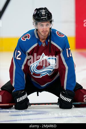 Colorado Avalanche center Jayson Megna, right pursues the puck while ...