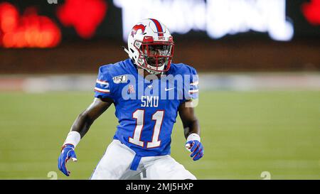 SMU wide receiver Rashee Rice, right, is tackled by East Carolina ...