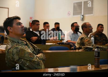 Airmen, Soldiers and civilians from El Salvador and the New Hampshire National Guard listen to a ...