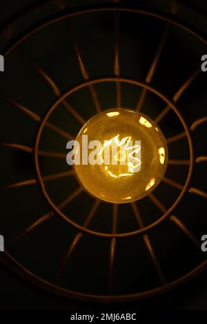 Stylish metallic pendant lamp with Edison light bulb indoors Stock ...