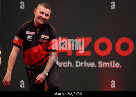 Nathan Aspinall reacts during his match against Michael van Gerwen on ...