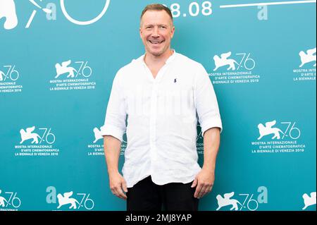Actor Aleksei Kravchenko poses for photographers at the photo call for the film 'The Painted ...