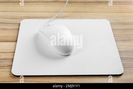 Modern wired optical mouse and pad on white background, top view Stock ...