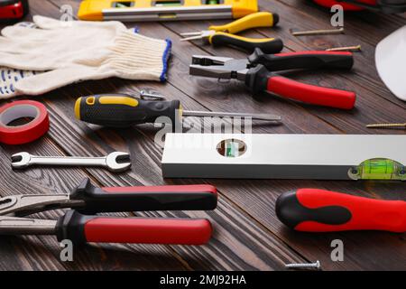 Different modern construction tools on wooden background Stock Photo ...