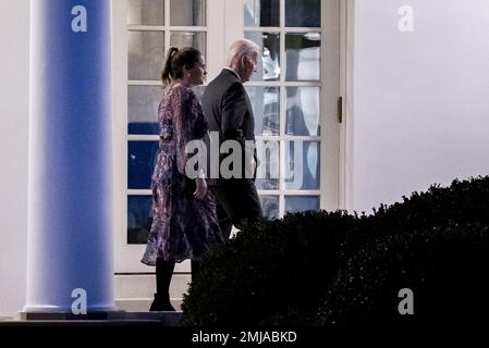 Annie Tomasini, director of Oval Office operations, left, follows ...