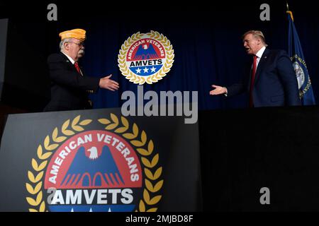 President Donald Trump greets AMVETS national commander Rege Riley at ...