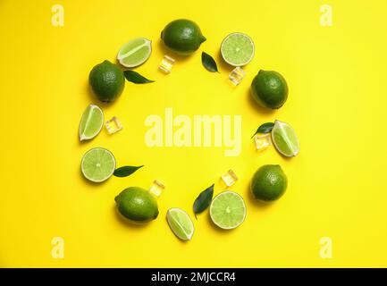 Round frame with limes, slices, leaves, and flowers, hand painted in ...