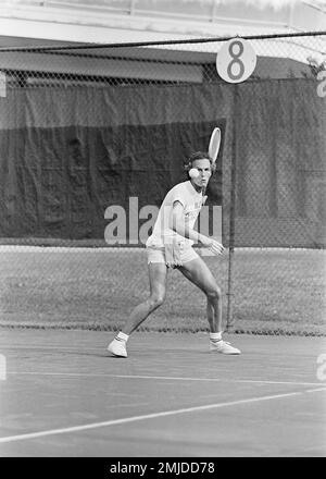 Dr. Richard Raskind prepares to return the ball during a tennis match ...