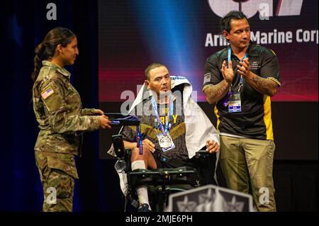 U.S. Army Capt. Luis Avila and his son Miguel Avila approach the ...