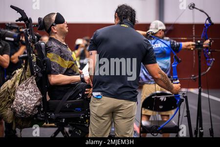 U.S. Army Capt. Luis Avila and his son Miguel Avila approach the ...