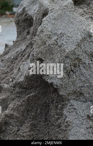 portrait of gray sand dunes as a raw material for building (walls ...