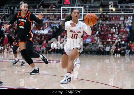 Oregon State forward Timea Gardiner (30) looks to pass against Colorado center Quay Miller (11 ...