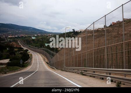 Fence that separates the city of Melilla from the Moroccan port of ...