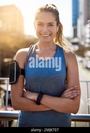 Getting ready for some road action. a young man tying his shoelaces ...