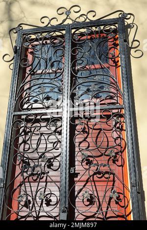 Wrought iron protector on a window of a house Stock Photo - Alamy