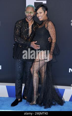 La'Myia Good, left, and Eric Bellinger arrive at the 64th Annual Grammy ...