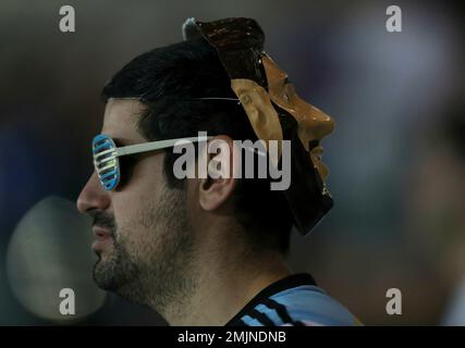 An Argentina wears a Lionel Messi mask prior to the FIFA World Cup ...