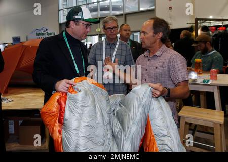 Colorado Gov. Jared Polis, left, joins his 7-year-old son, Caspian, in ...