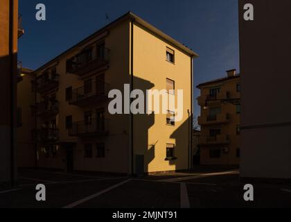 Yellow Apartment building in Venice, Italy with high lighting contrast ...