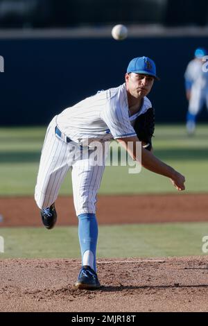 UCLA's Nick Nastrini (30) throws to a Michigan batter during an NCAA ...