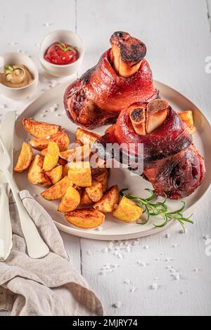 Cripsy roasted pork knuckle served with sauerkraut and potatoes ...