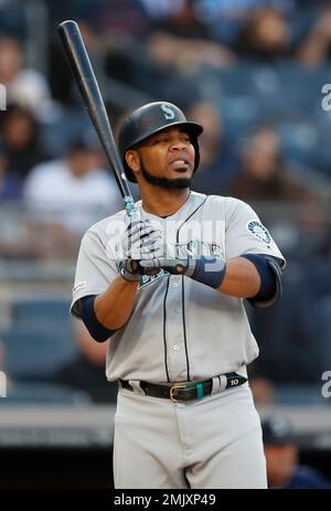Seattle Mariners first baseman Edwin Encarnacion completes a dive onto ...