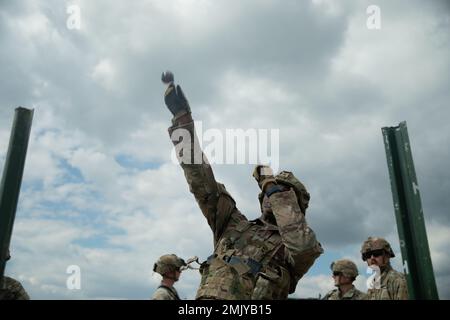 A U.S. Soldier throws the M67 grenade during the weapons lane, to earn ...