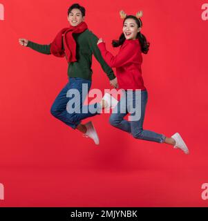 Happy young couple jumps Stock Photo - Alamy