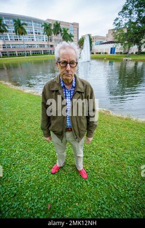 Wide angle perspective of handsome senior man at home with a big smile ...