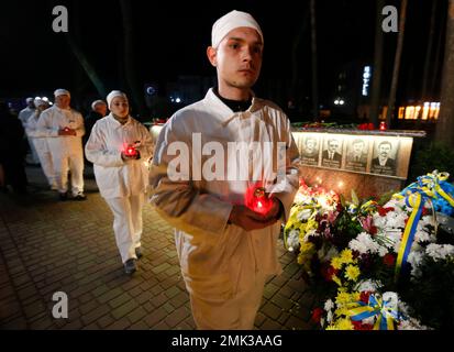 The Chernobyl nuclear plant workers in uniform attend a ceremony to ...