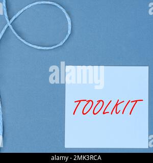 Hand writing sign Toolkit, Business overview set of tools kept in a bag ...