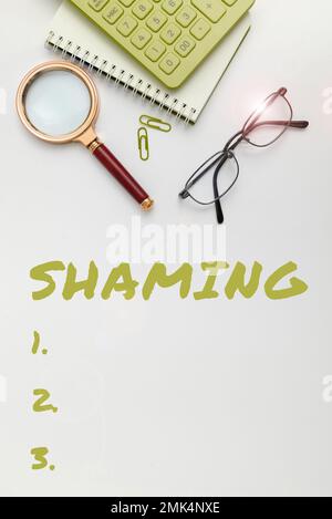 Sign displaying Shaming. Word Written on subjecting someone to disgrace ...