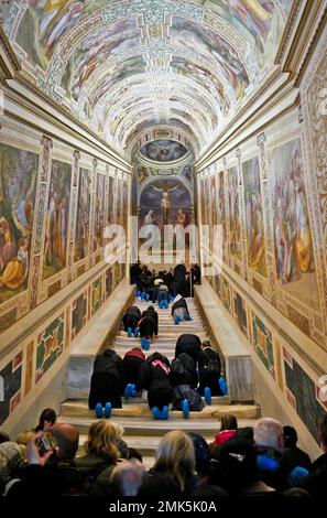 Faithful kneel on the newly restored Holy Stairs (Scala Sancta), which ...