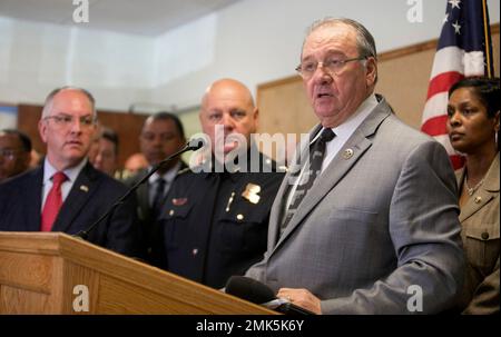 St. Landry Parish Sheriff Bobby Guidroz rubs his face as Louisiana Gov ...