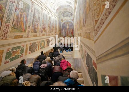 Faithful kneel on the newly restored Holy Stairs (Scala Sancta), which ...