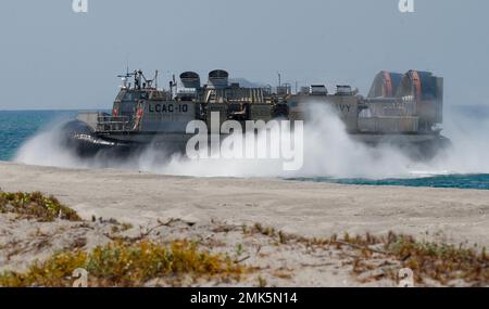US Navy An LCAC (Landing Craft Air Cushion) as it comes ashore in ...