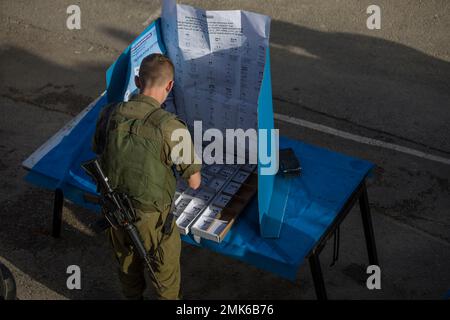 Israeli soldiers cast their ballots oat a mobile voting booth, two days ...