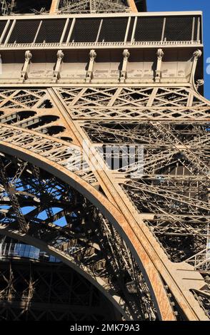 Detail showing the intricate ironwork of the iconic Eiffel Tower in ...