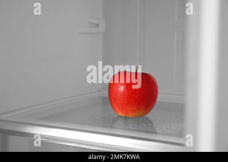 Red apple on shelf inside modern refrigerator Stock Photo - Alamy