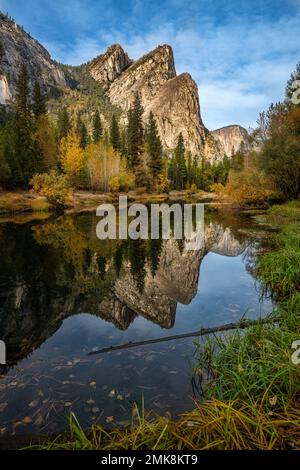 The famous Three Brothers rock formation along the Merced River in ...