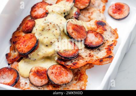 pork fillet with sausage and mustard sauce Stock Photo - Alamy